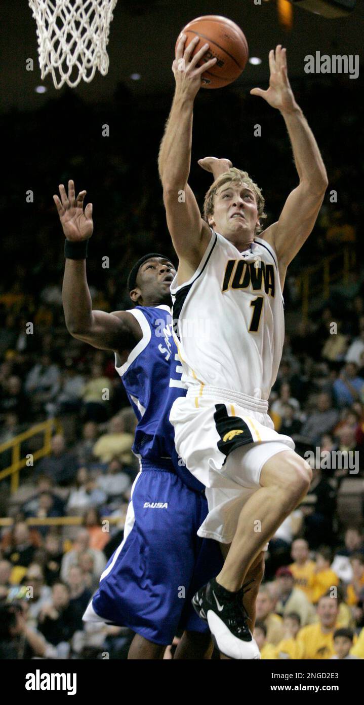 Iowa's Adam Haluska, right, drives to the basket past Saint Louis ...