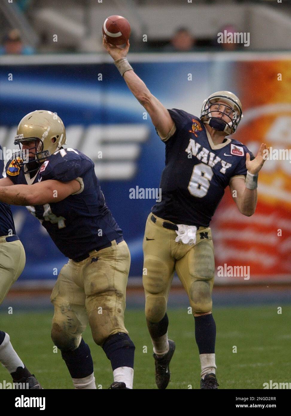 Navy quarterback Aaron Polanco, right, passes in front of center August ...