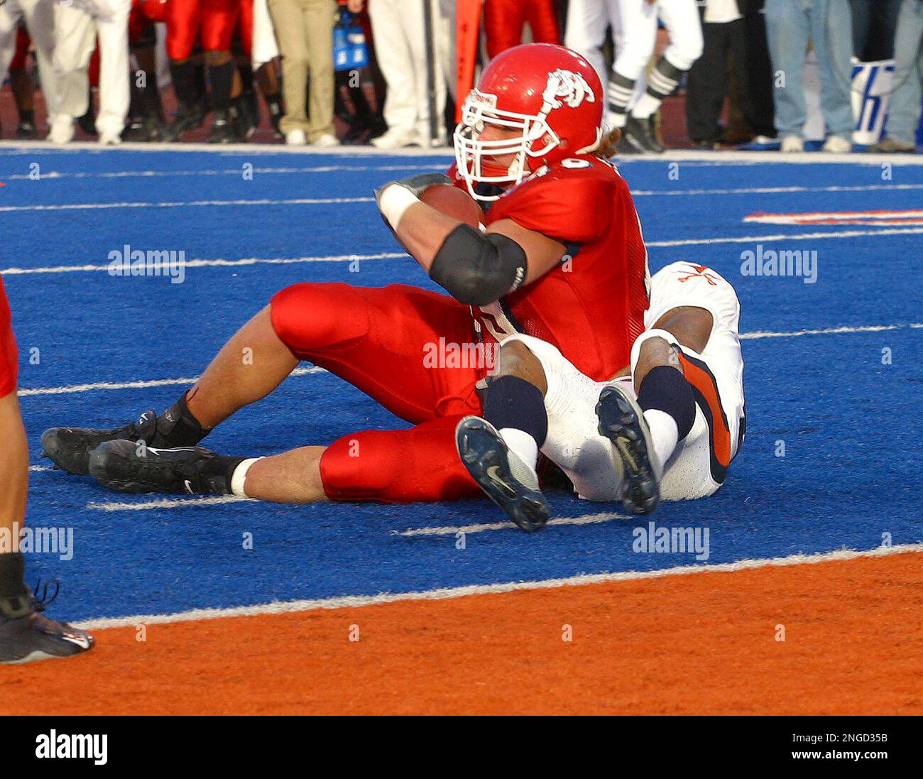 Fresno State tight end Stephen Spach (49) hits the blue field turf at ...
