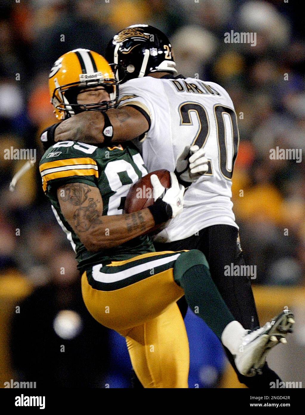 Green Bay Packers receiver Robert Ferguson is hit by Jacksonville ...