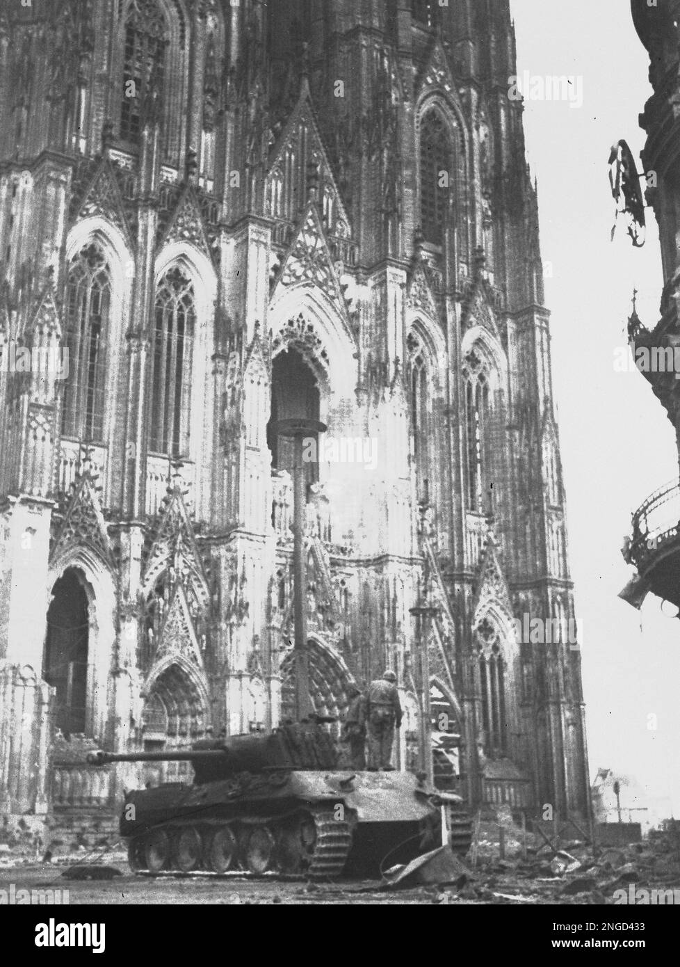 Troops of the 1st U.S. Army examine a German Panzer tank and its ...
