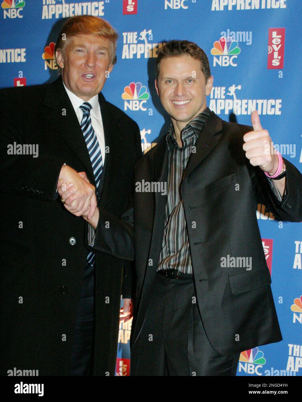 Kelly Perdew, right, gives the thumbs up as he shakes hands with Donald ...