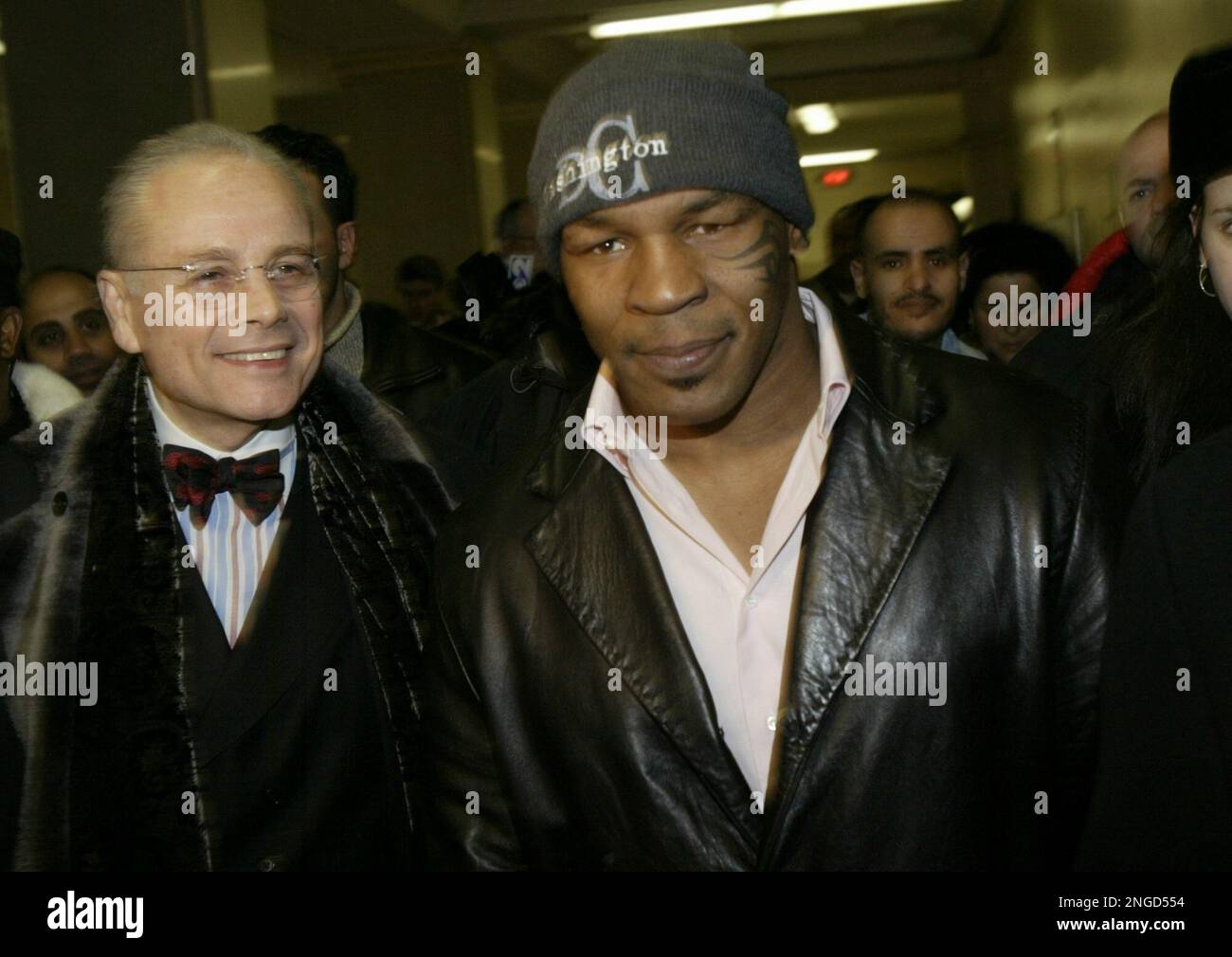 Heavyweight boxer Mike Tyson, right, enters a Brooklyn, N.Y. court ...