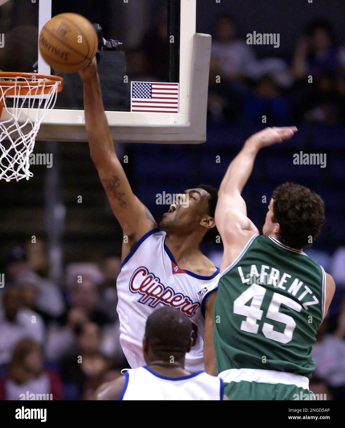 Los Angeles Clippers' Mikki Moore dunks on Boston Celtics' Raef ...