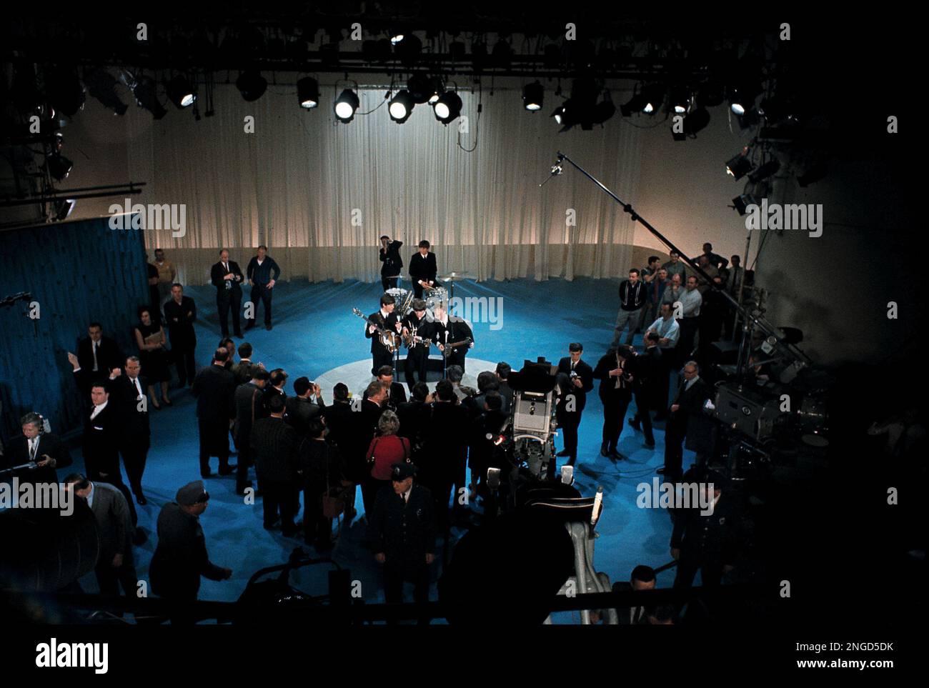 The British rock and roll group the Beatles, center, are surrounded by ...