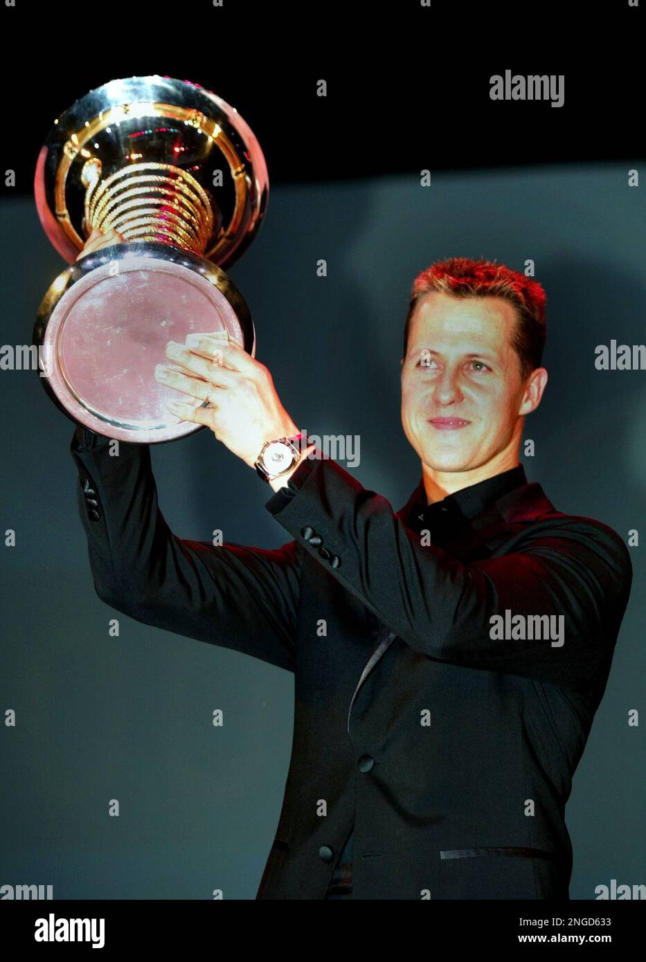 German Formula One driver Michael Schumacher holds his FIA Formula One ...