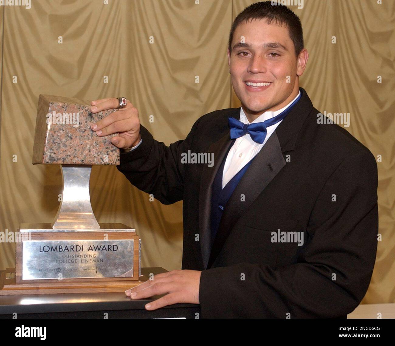Georgia defensive end Dave Pollack poses with the Lombardi Award trophy ...