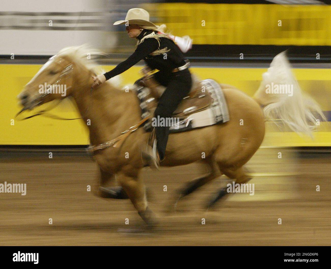 Amanda Clayman of Naylor Mo.,competes in the barrel racing competition ...