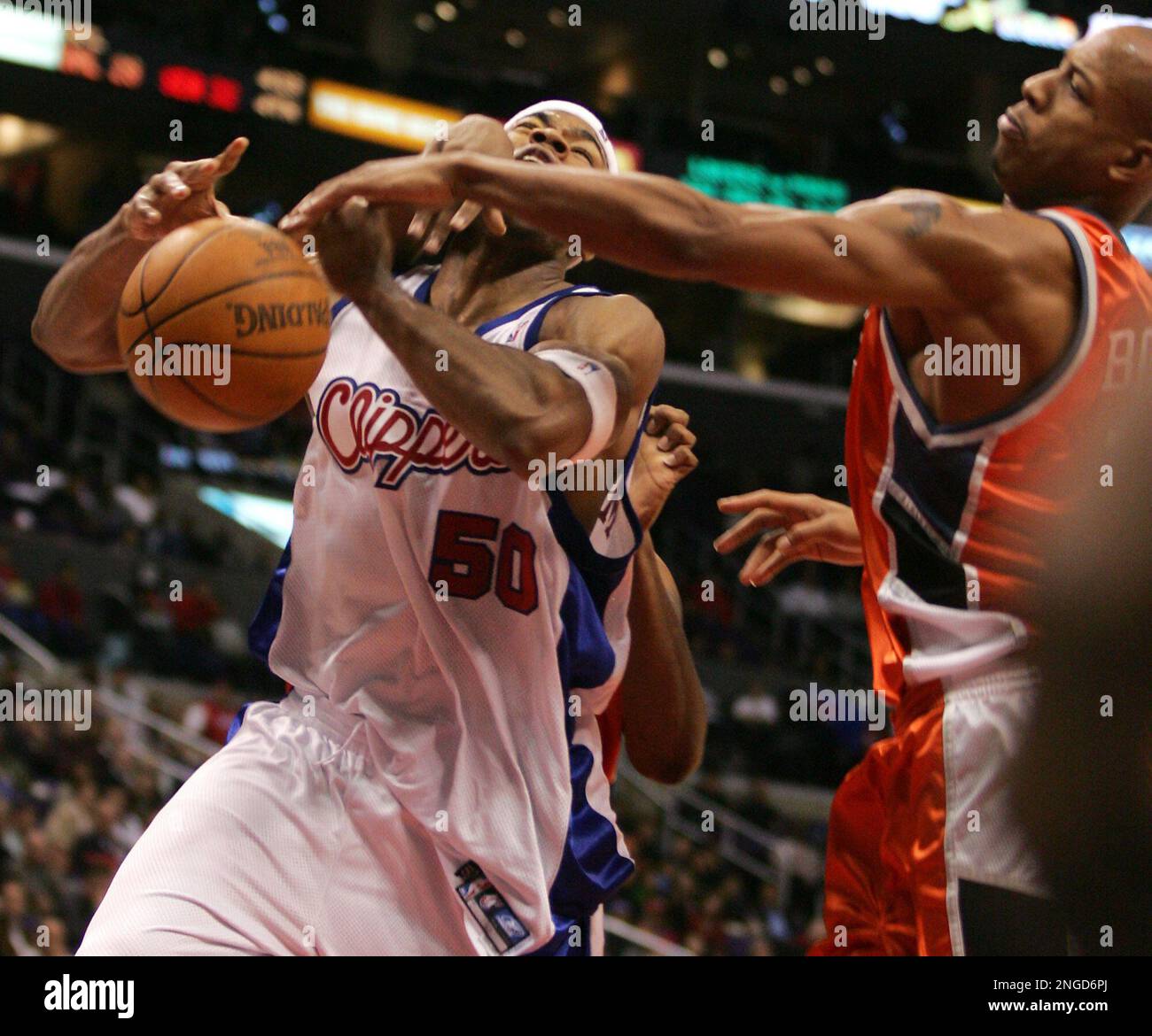Los Angeles Clippers' Corey Maggette, left, is hit in the face by ...