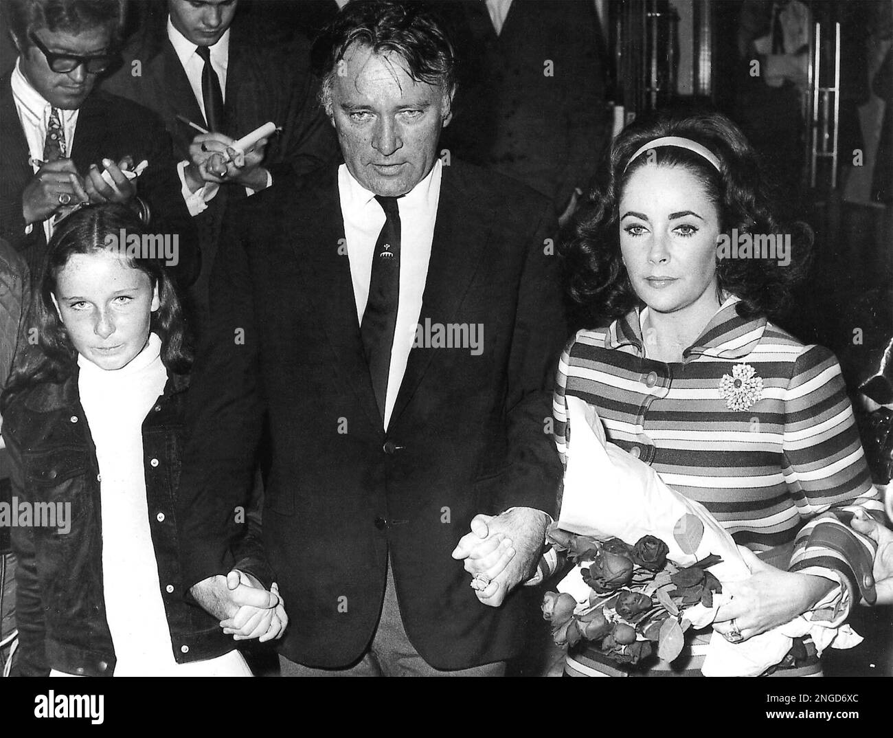 Actress Elizabeth Taylor, accompanied by her husband, actor Richard ...