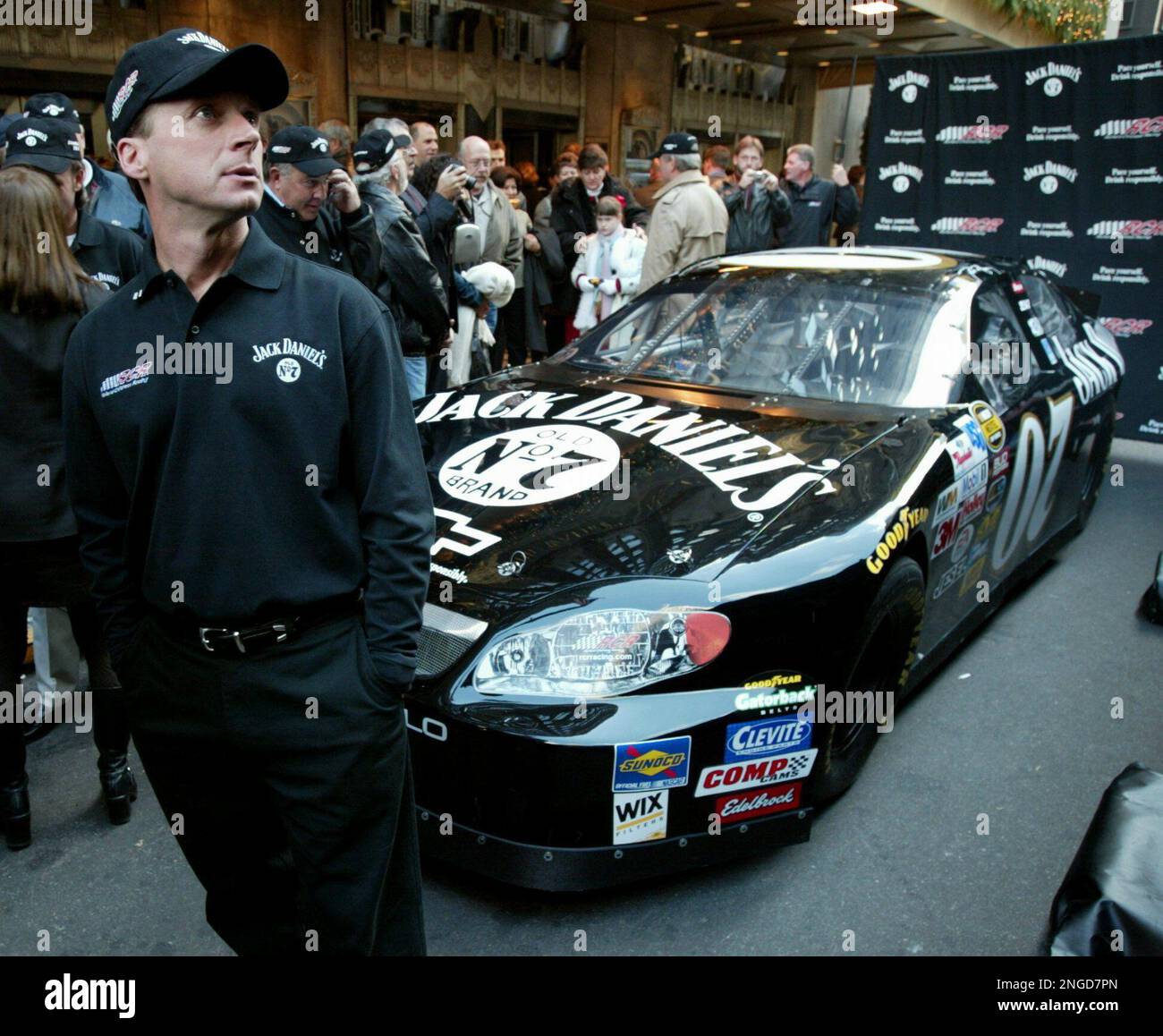 NASCAR driver Dave Blaney looks around at city skyscrapers during a ...