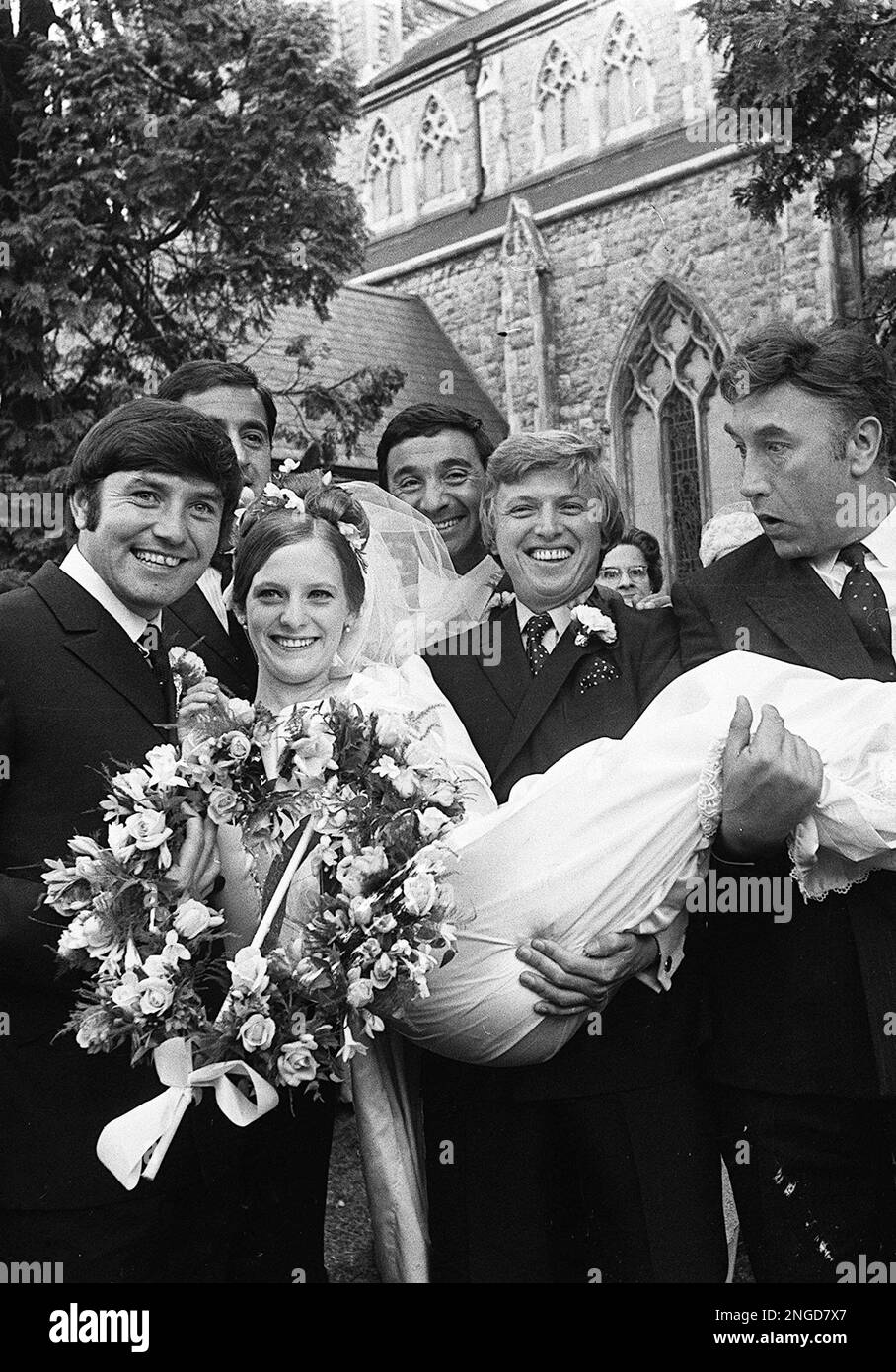 British pop singer Tommy Steele, centre, carries his sister Sandra ...