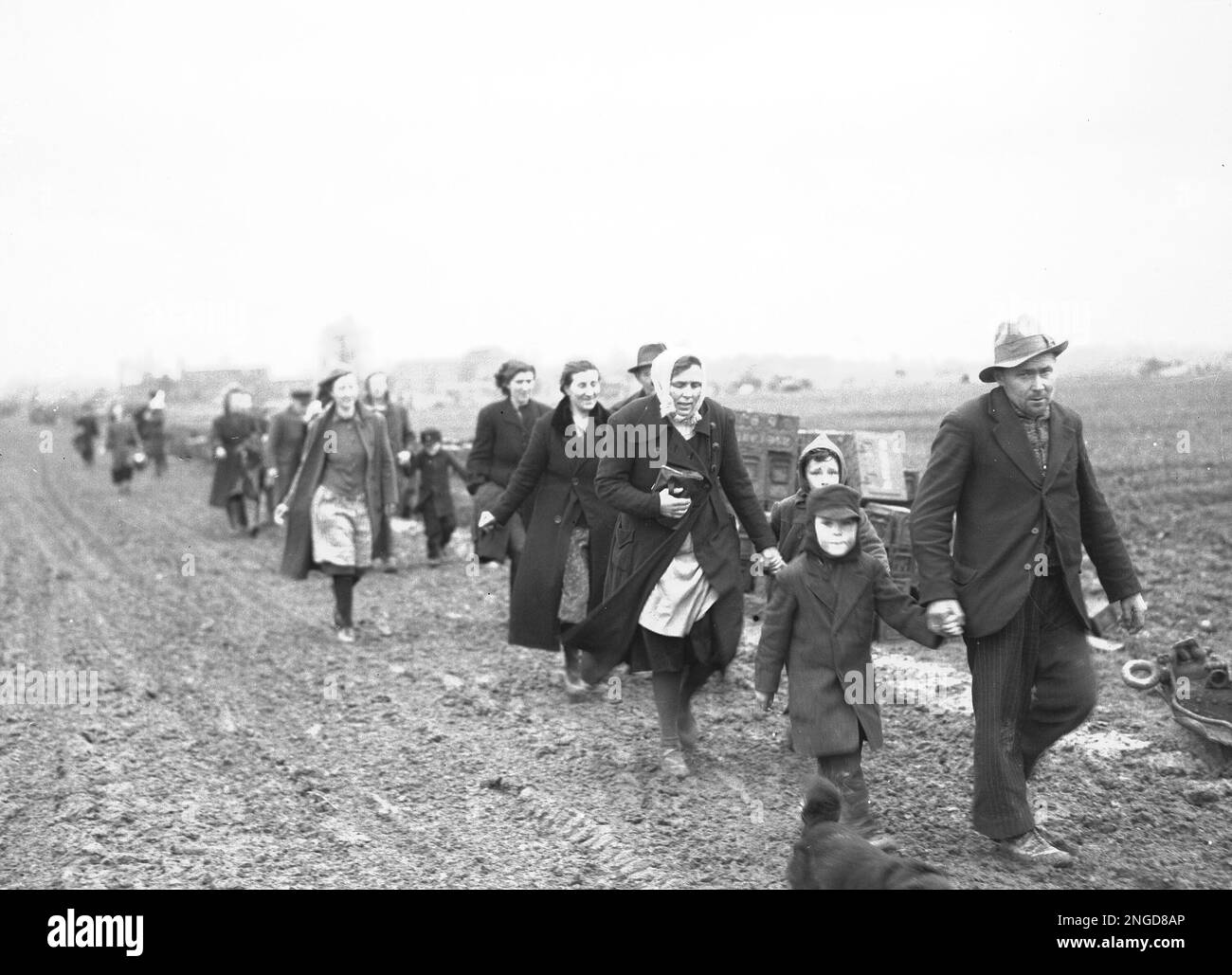 A procession of German civilians walk along the Calcar road towards ...