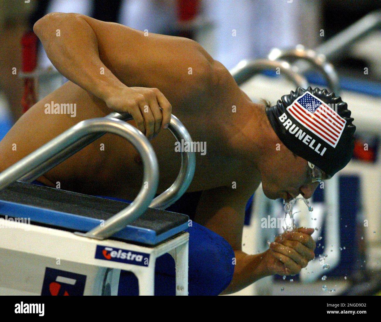 American swimmer Nick Brunelli scoops up some water before the start of ...