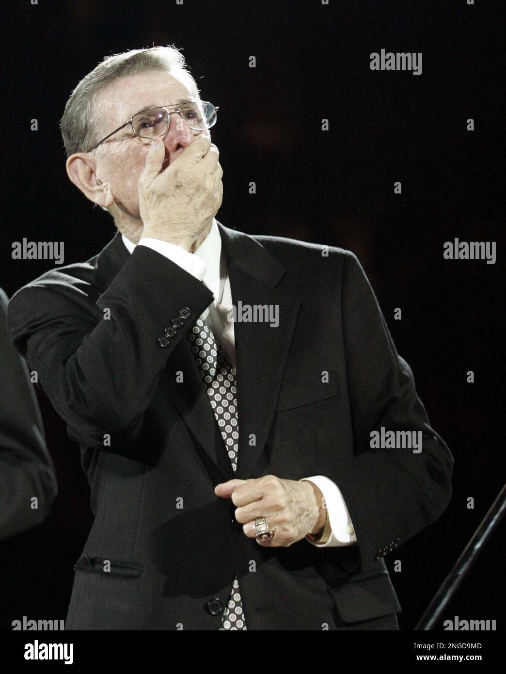 Former St. John's basketball coach Lou Carnesecca reacts during a ...