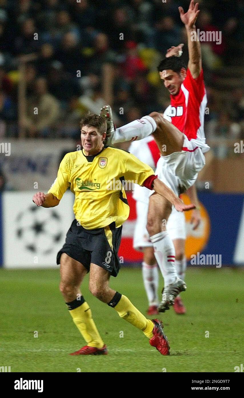 AS Monaco player Andreas Zicos ,right, hits Steven Gerrard, of ...