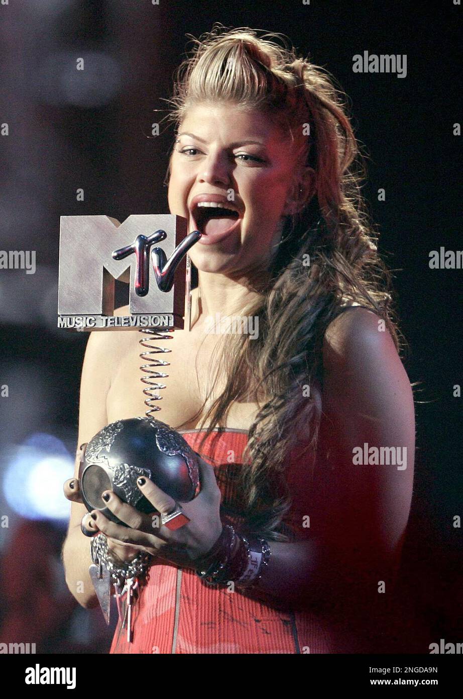 U.S. group The Black Eyed Peas' singer Fergie shows the just received ...