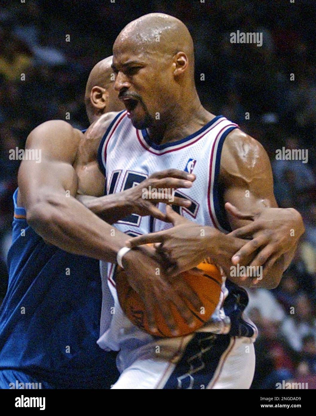 New Jersey Nets' Travis Best is fouled by Washington Wizards' Jarvis ...