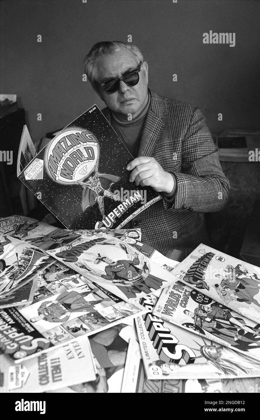 Joe Shuster poses with numerous comic books of Superman, the cartoon ...