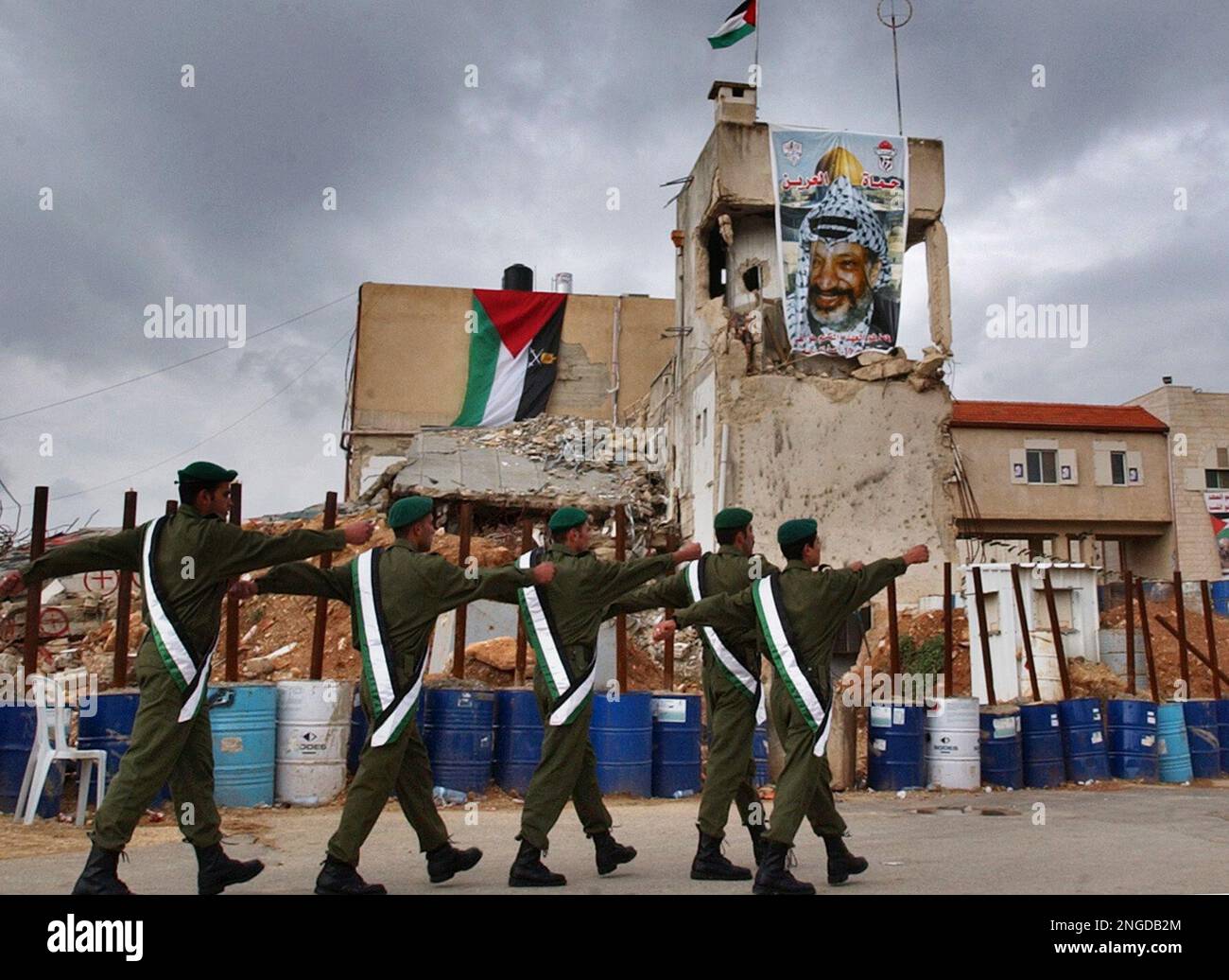 The Palestinian honor guard march as they change the guard at Yasser ...