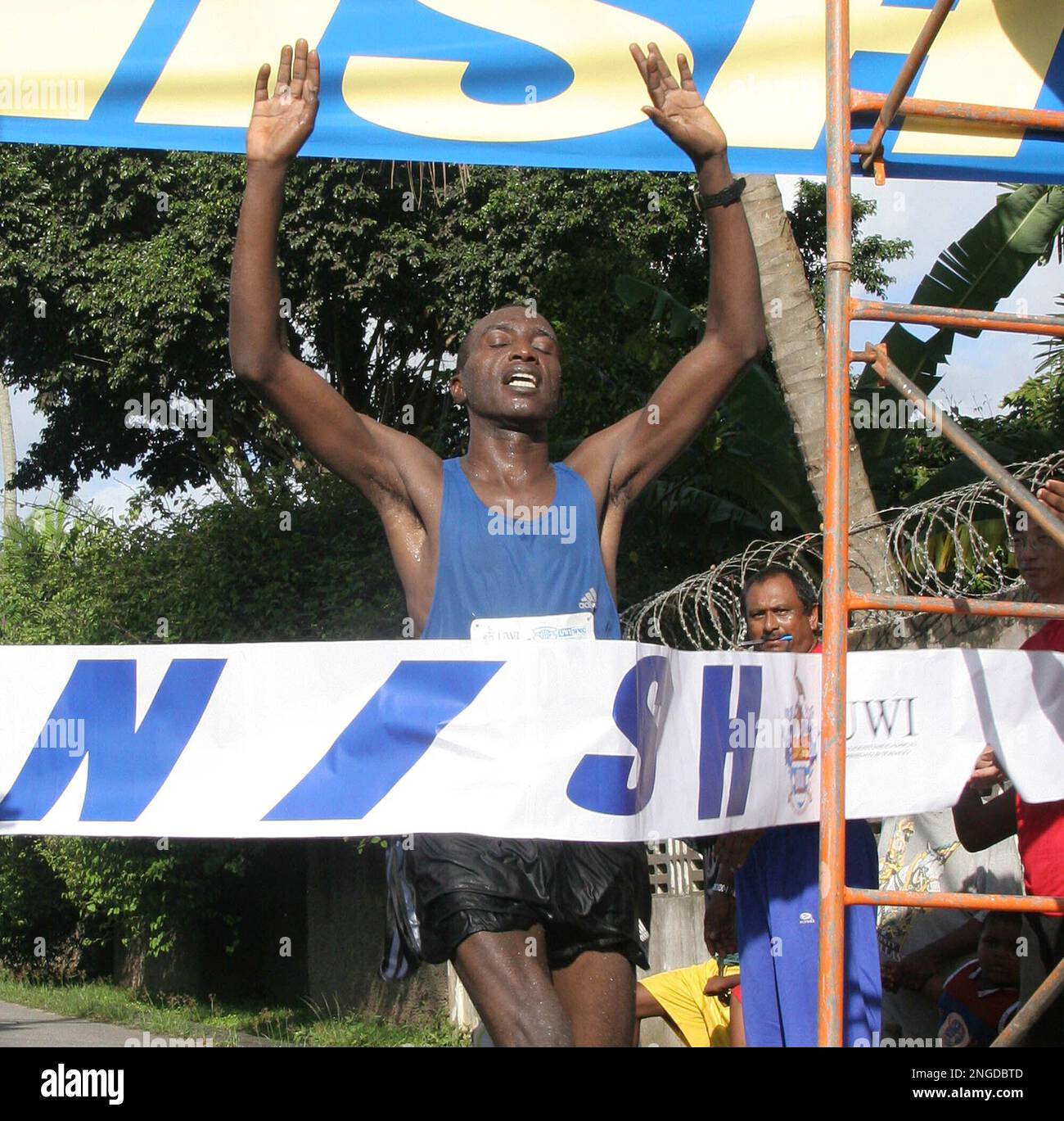 John Muriuki of Kenya crossing the finish line, winning the UWI ...