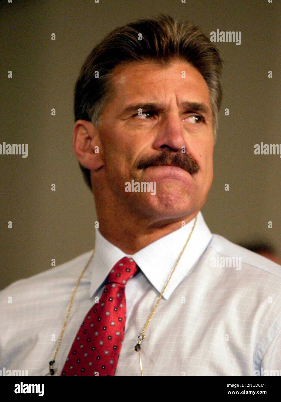 Miami Dolphins head coach Dave Wannstedt waits to speak at the start of ...