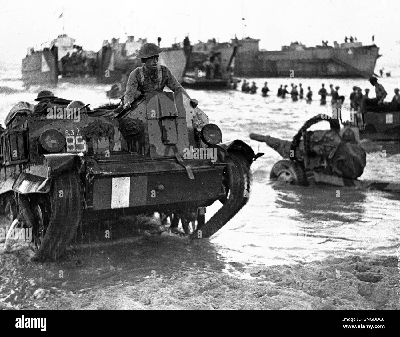 Allied Forces, troops, guns and transport are rushed ashore, ready for ...