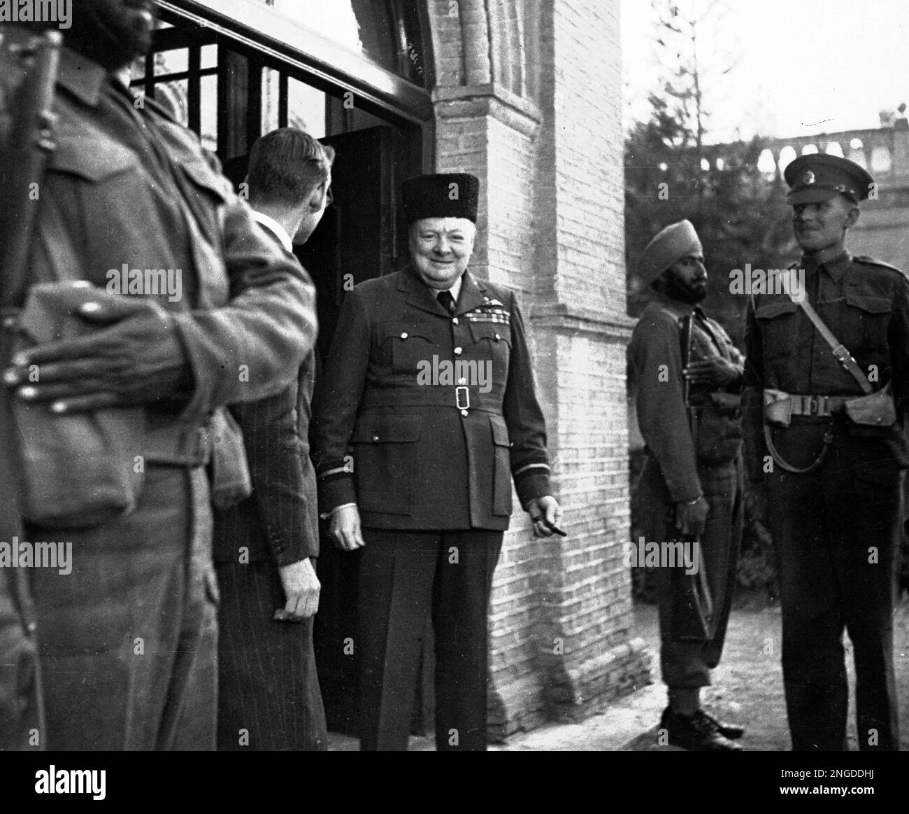 Britain's Prime Minister Winston Churchill wears a caracul hat ...