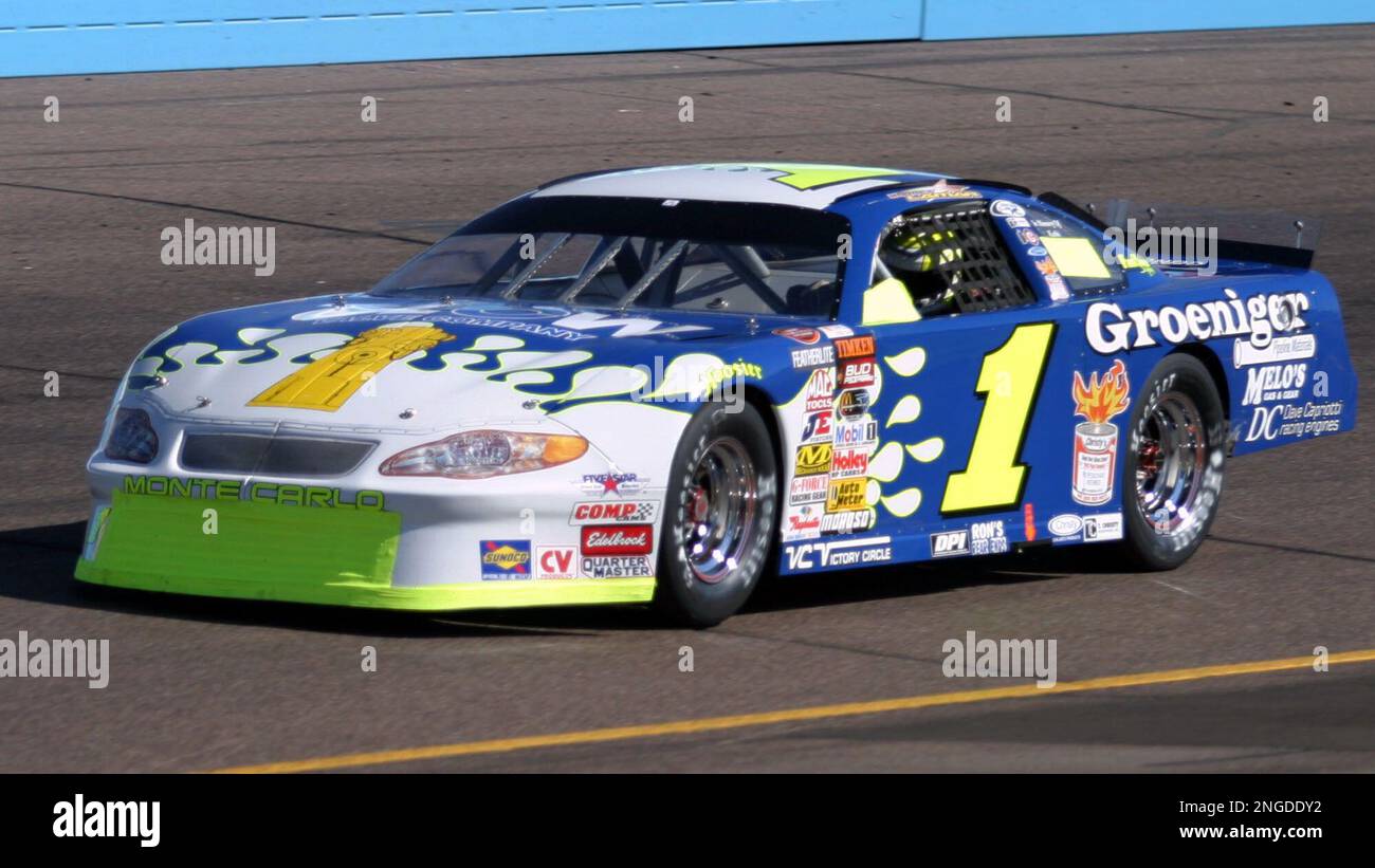 Burney Lamar drives through turn four at the Phoenix International ...