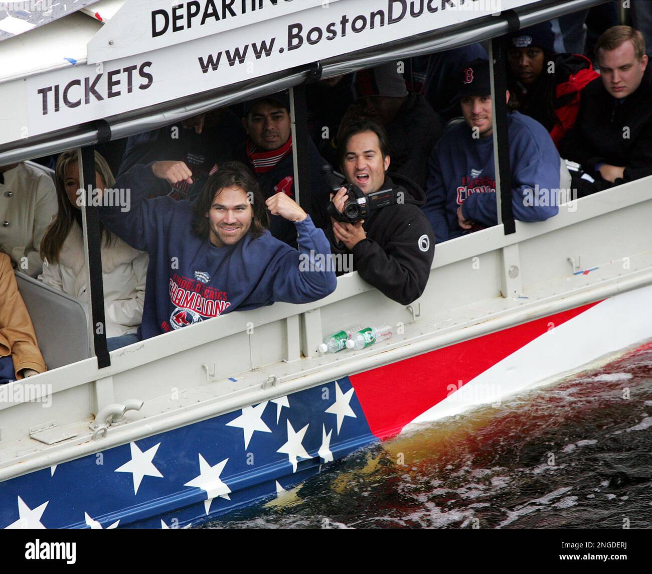 Boston Red Sox's Johnny Damon, left, poses from a Duck boat on the ...