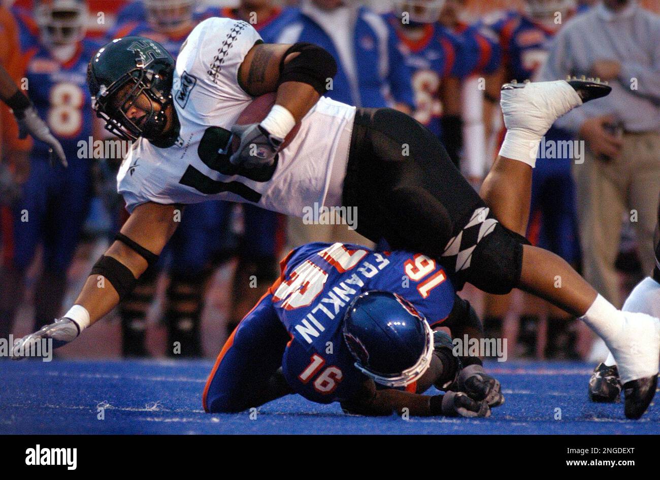 Hawaii running back West Keliikipi gets taken down by Boise State ...