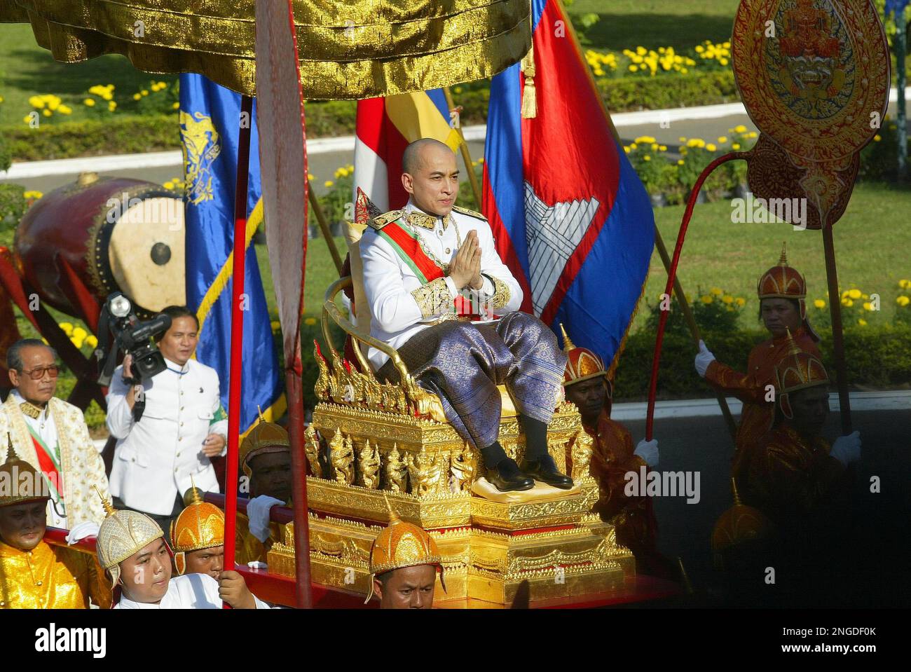 King Norodom Sihamoni is carried to the throne room at the Royal Palace ...