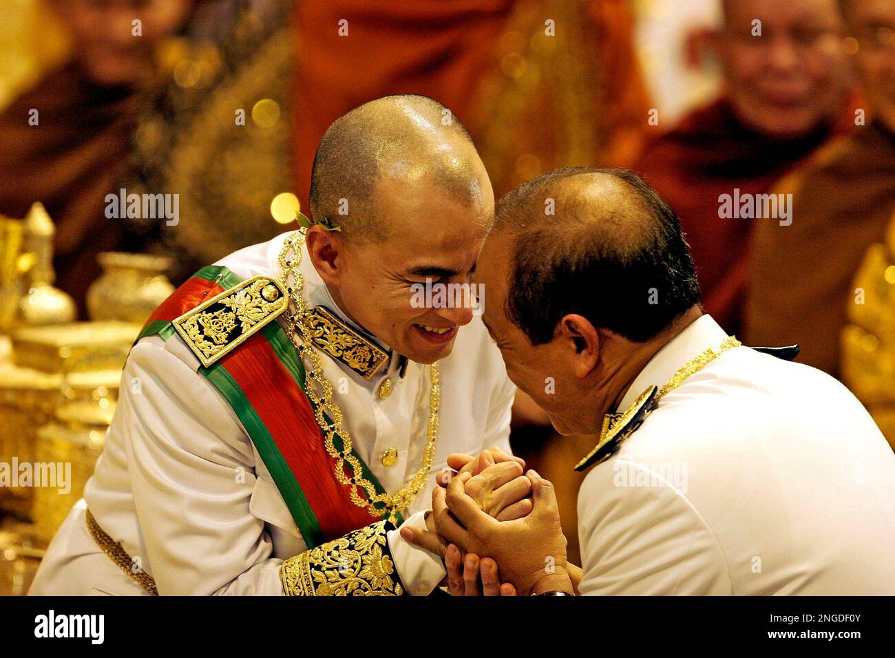 King Norodom Sihamoni, left, greets his brother Prince Norodom ...