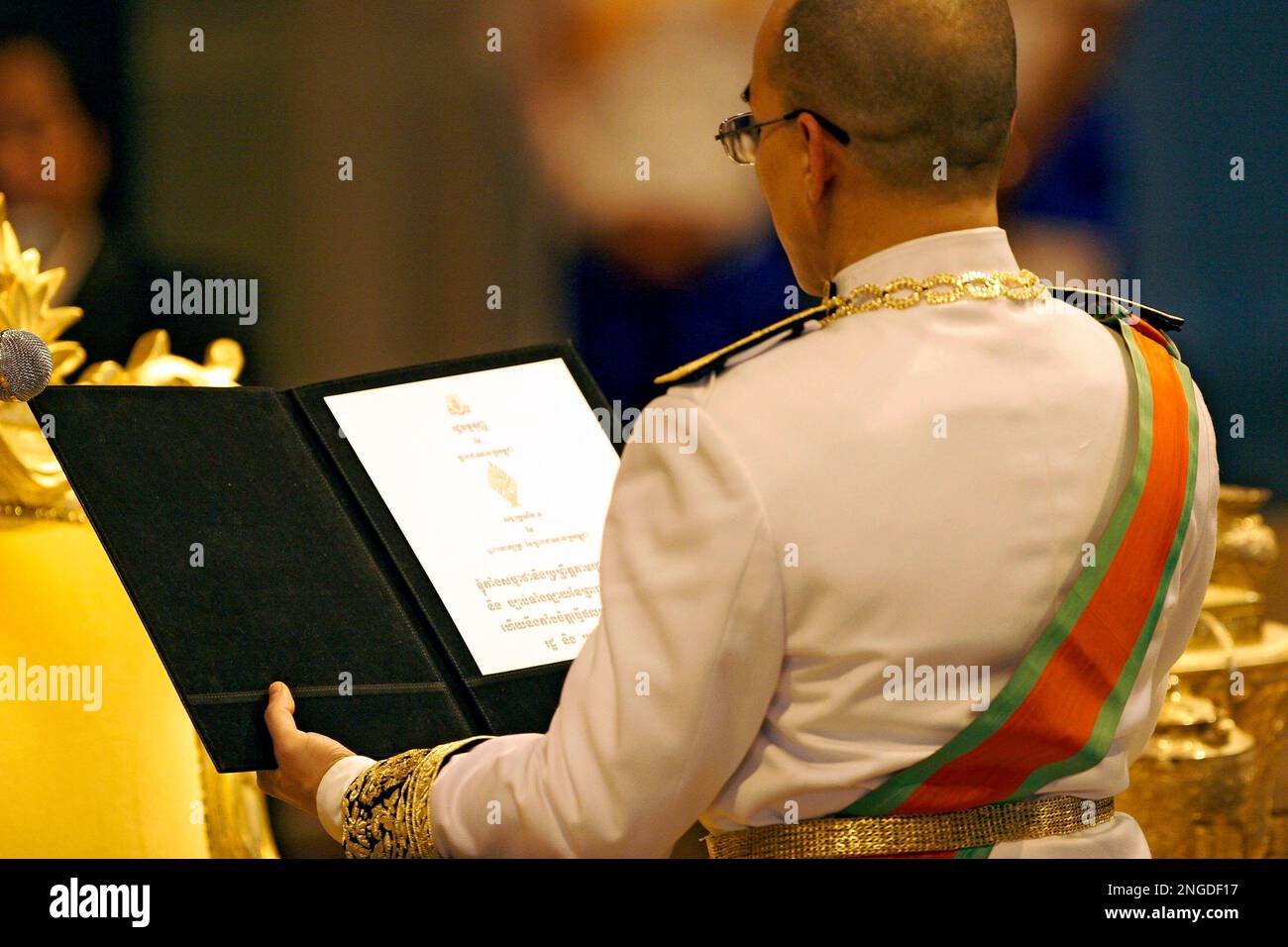 Cambodian King Norodom Sihamoni reads the oath of office during ...