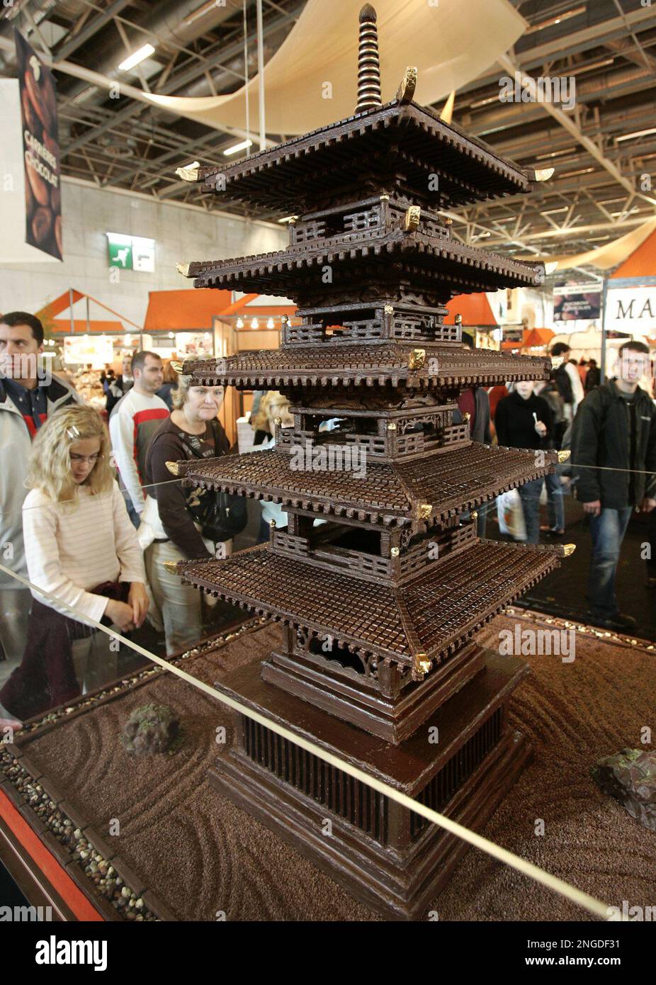 Visitors take a look at a chocolate pagoda during the Chocolate Show ...