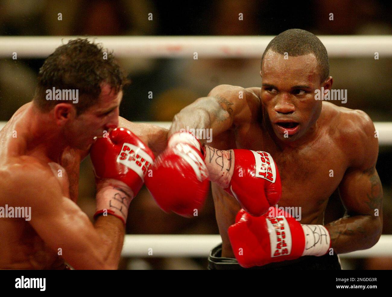 U.S. boxer Vivian Harris, from New York, right, throws a punch at ...