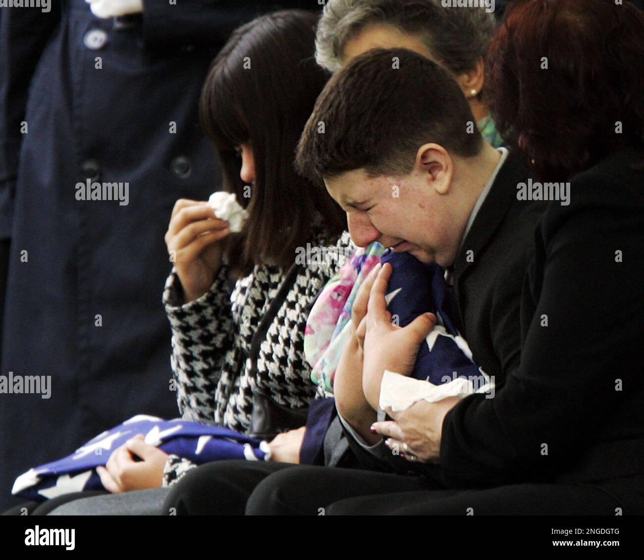 Dean Cunningham, son of U.S. Army Staff Sgt. Darren Cunningham, weeps ...