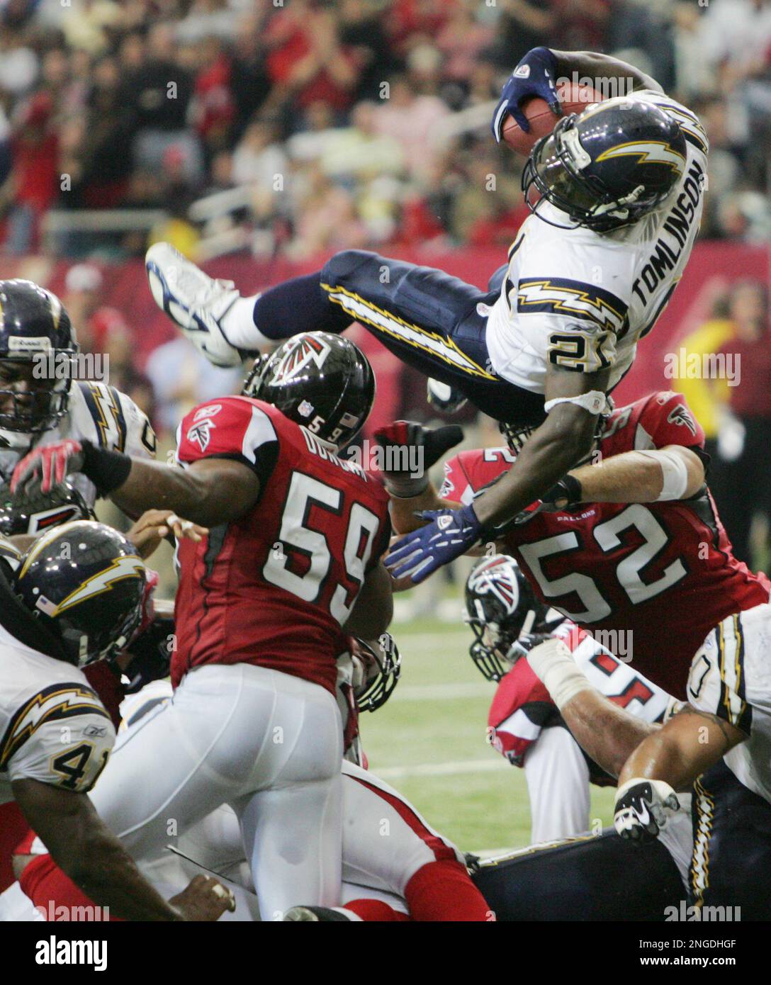 San Diego Chargers running back LaDainian Tomlinson (21) goes over ...