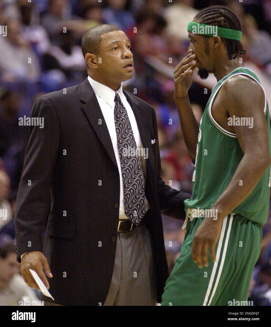 Celtics new coach Glenn "Doc" Rivers, left, talks with Ricky Davis (12 ...