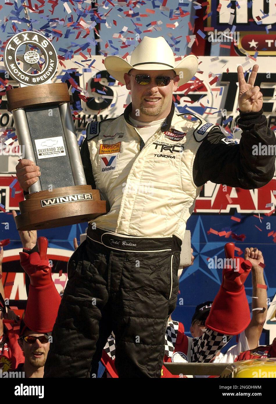 Todd Bodine holds his trophy in victory lane after winning the NASCAR ...
