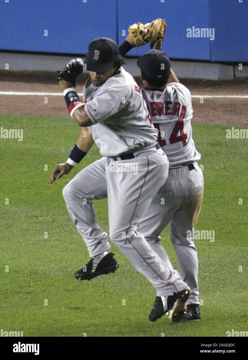 Boston Red Sox shortstop Orlando Cabrera, right, and left fielder Manny ...
