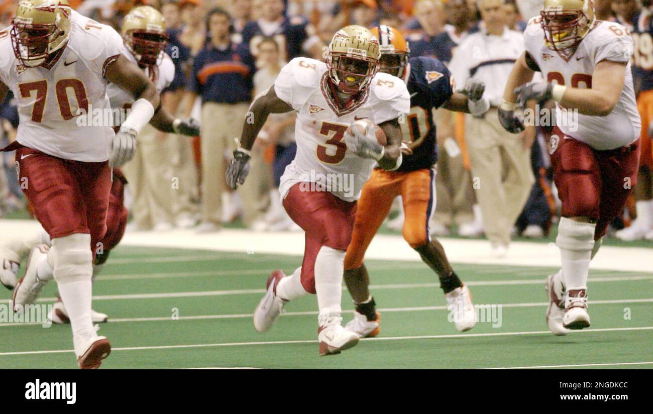 Florida State's Leon Washington (3) runs woth blockers Alex Barron (70 ...