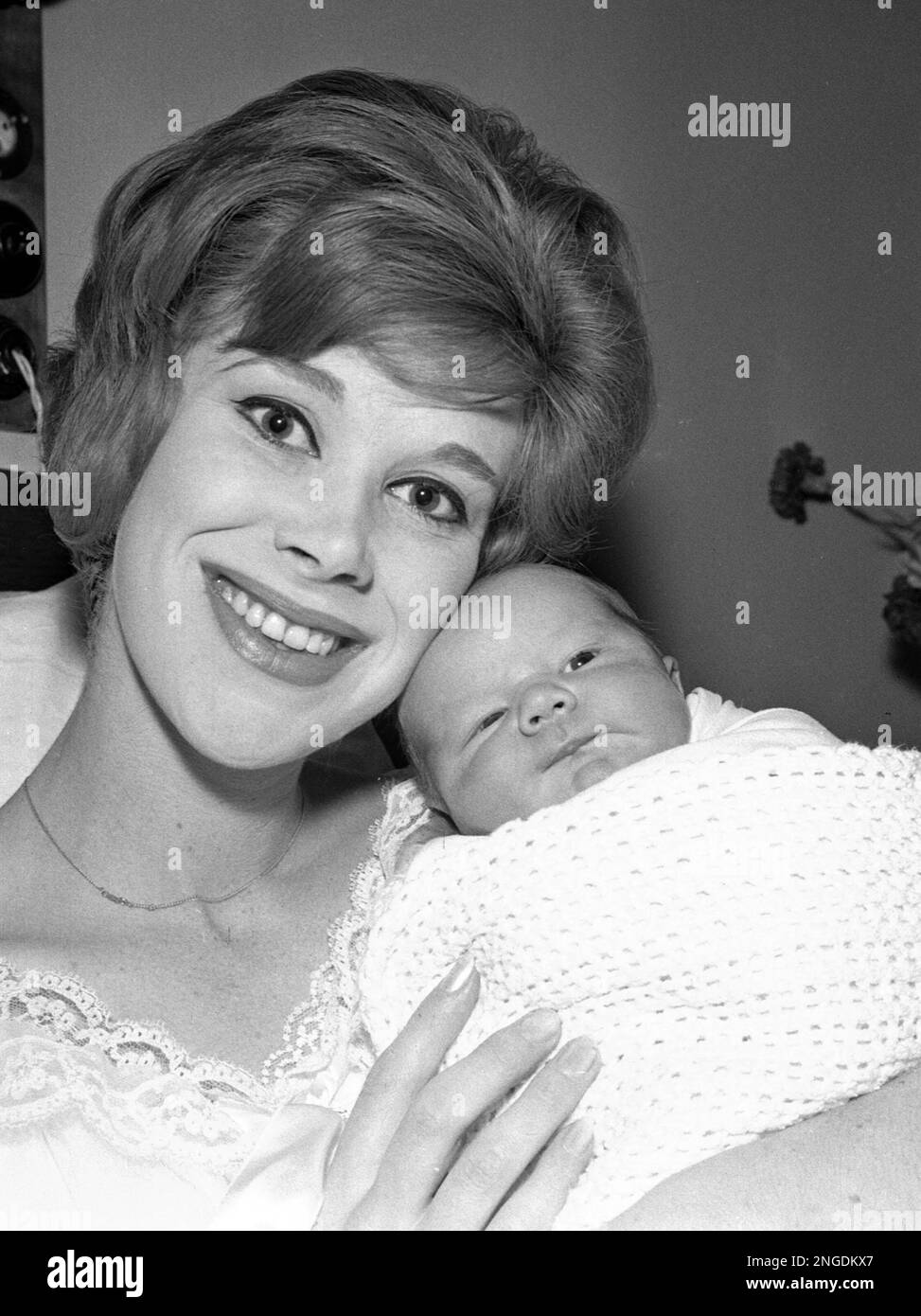 British actress Wendy Craig proudly presents her new born baby son Ross ...