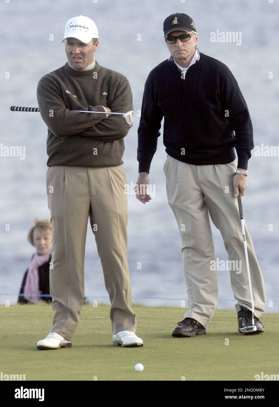 Actor Michael Douglas, left, stands next to French golfer Thomas Levet ...