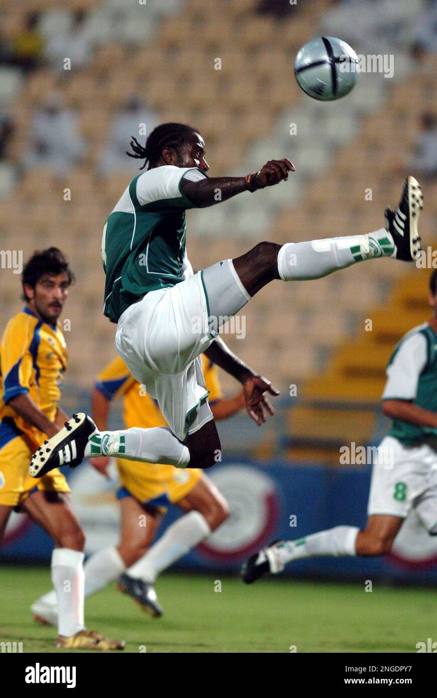 Al Ahli Club's Cape Verdian player Jose Carfilo makes a flying kick ...