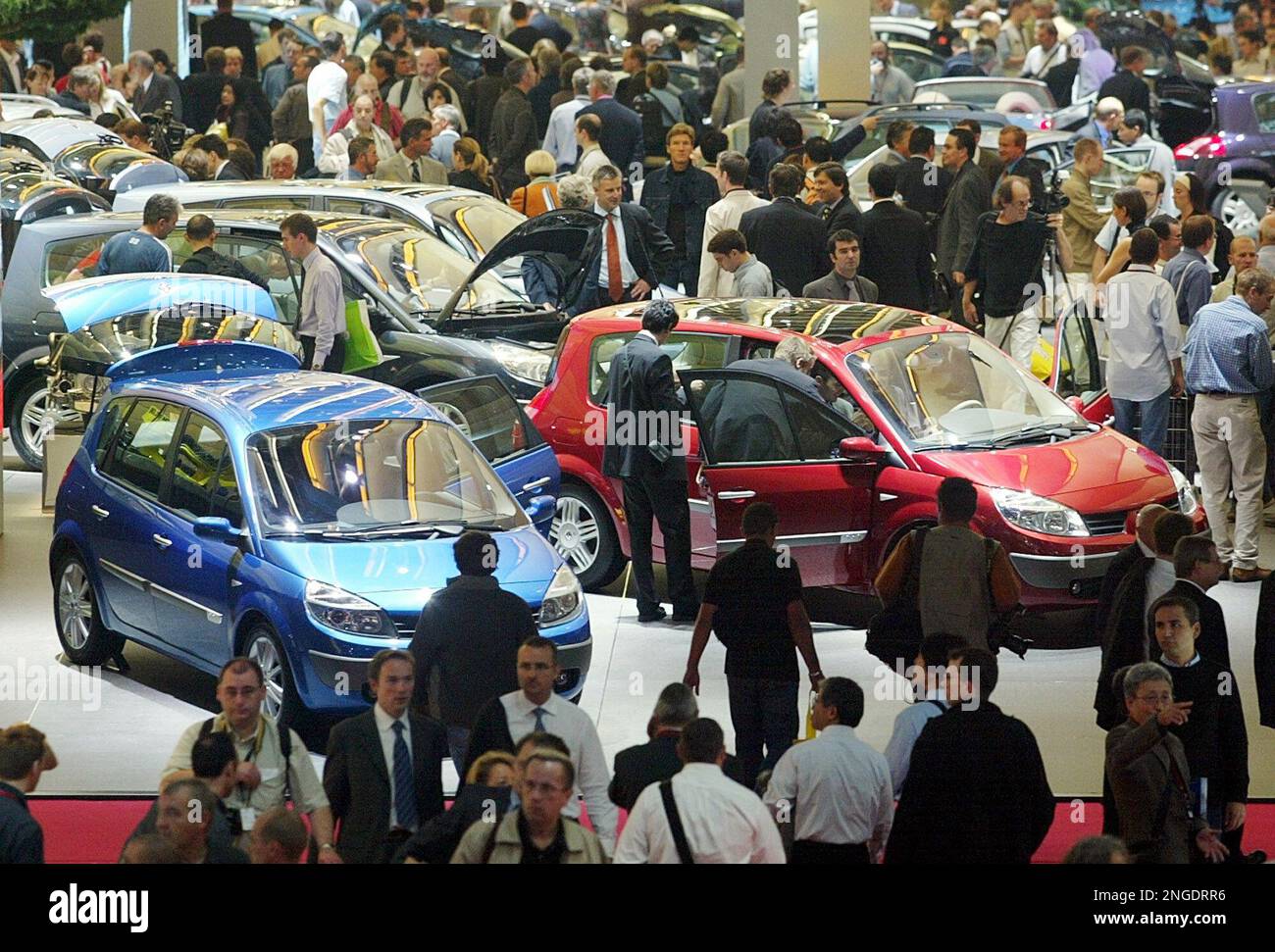Reporters crowd the Renault stand during the first of two press days at ...