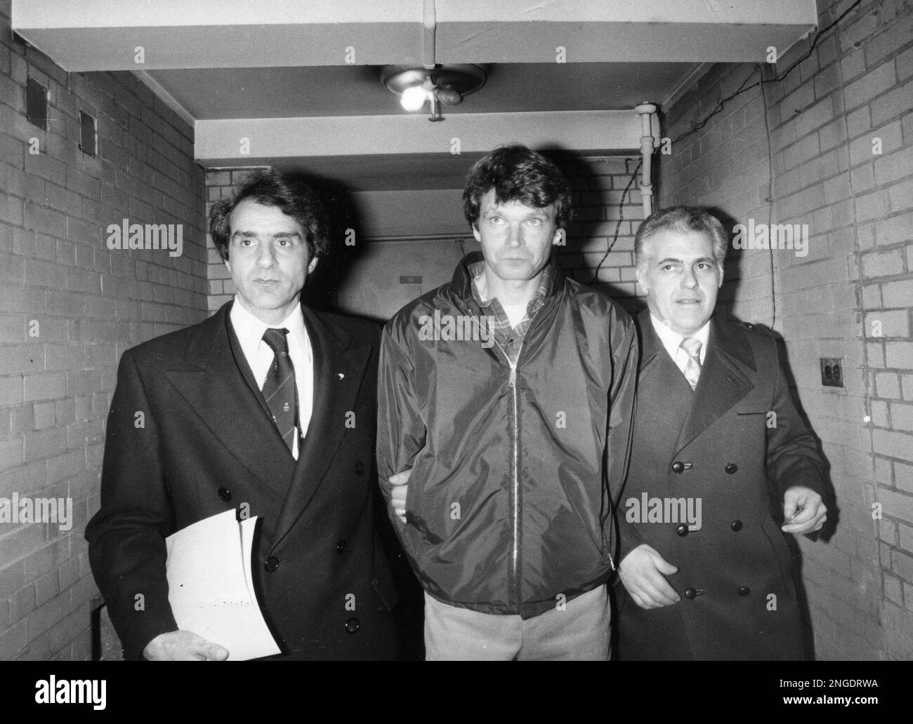 Unidentified detectives escort Dennis Sweeney, a 37-year old carpenter ...