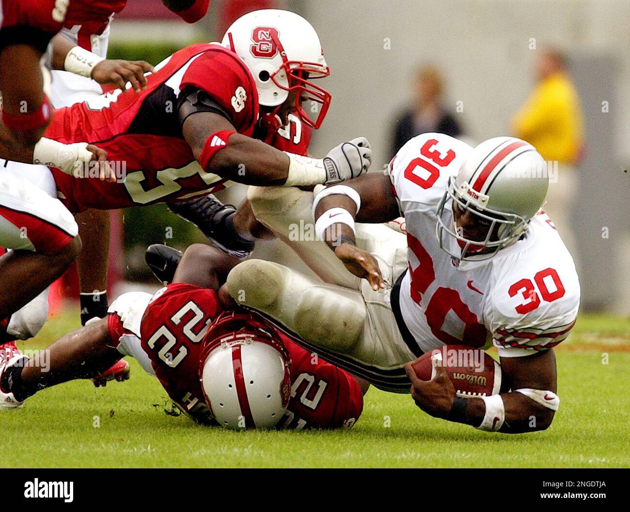 Ohio State's Lydell Ross (30) tries to break away from North Carolina ...