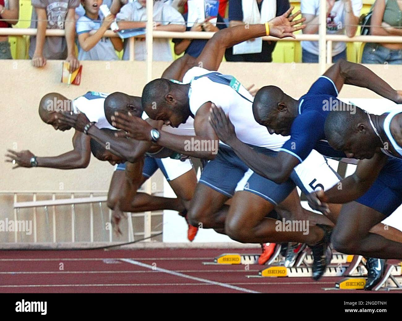Asafa Powell of Jamaica, third from right takes the start of the men's ...