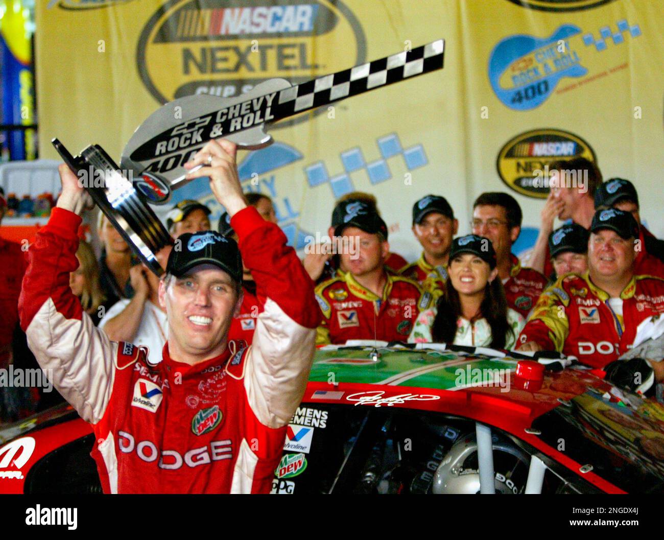 Jeremy Mayfield, winner of the NASCAR Chevy Rock & Roll 400, holds his ...